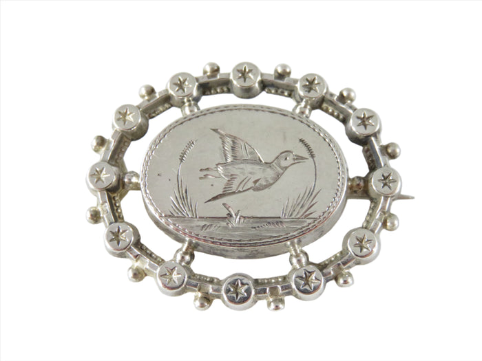 Victorian Aesthetic Movement Sterling Etched Bird Brooch with Starburs
